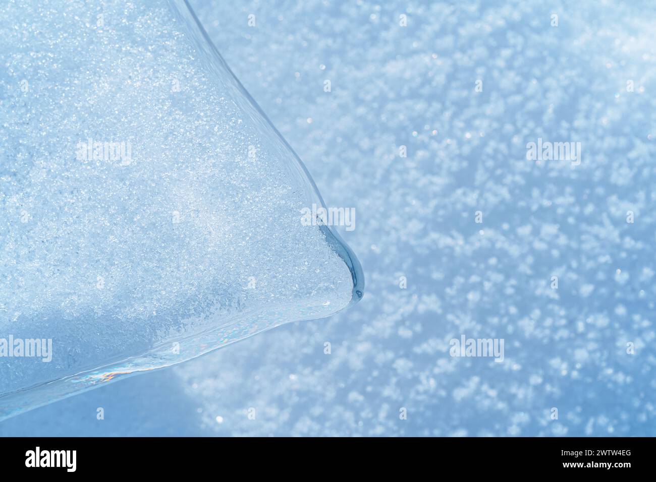 Ice hummocks covered in snow on Baikal Lake. Transparent blue ice floe ...