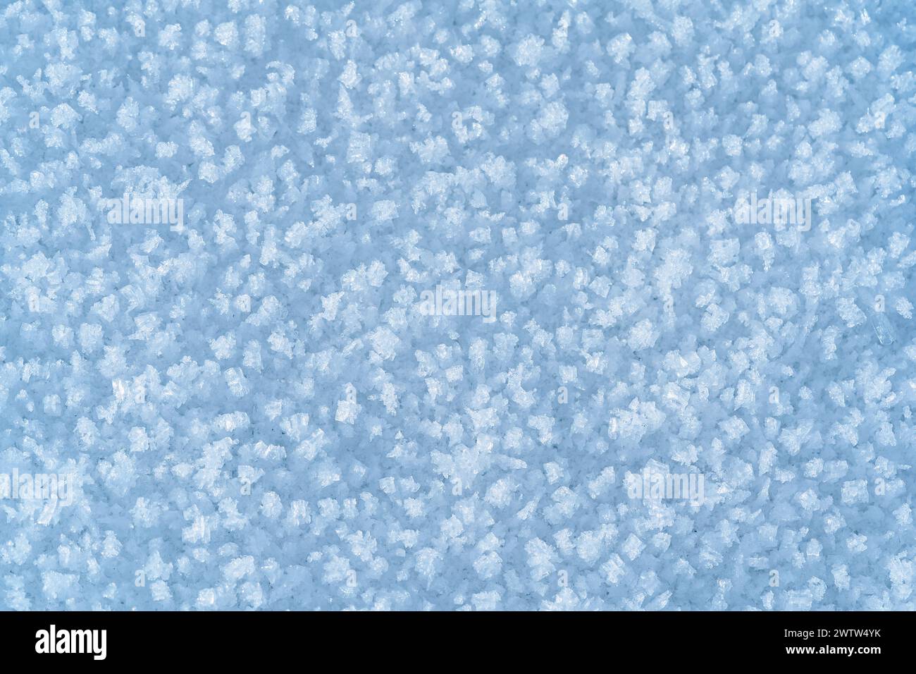 Ice hummocks covered in snow on Baikal Lake. Transparent blue ice floe ...