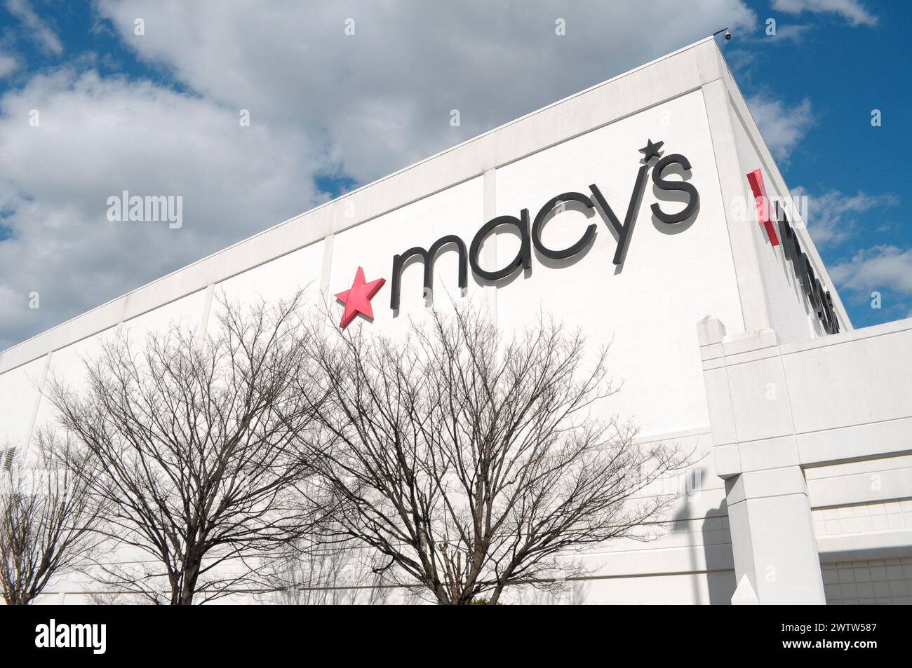 A Macy's logo is seen on a store in the neighborhood of Garden City in ...