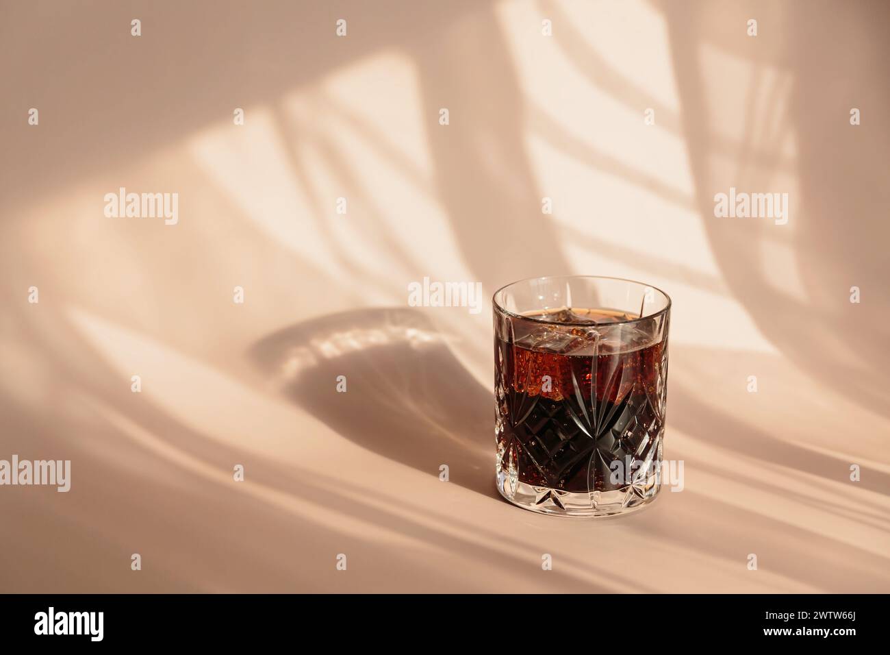 Whiskey cola cocktail with strong alcohol and ice in highball glass ...