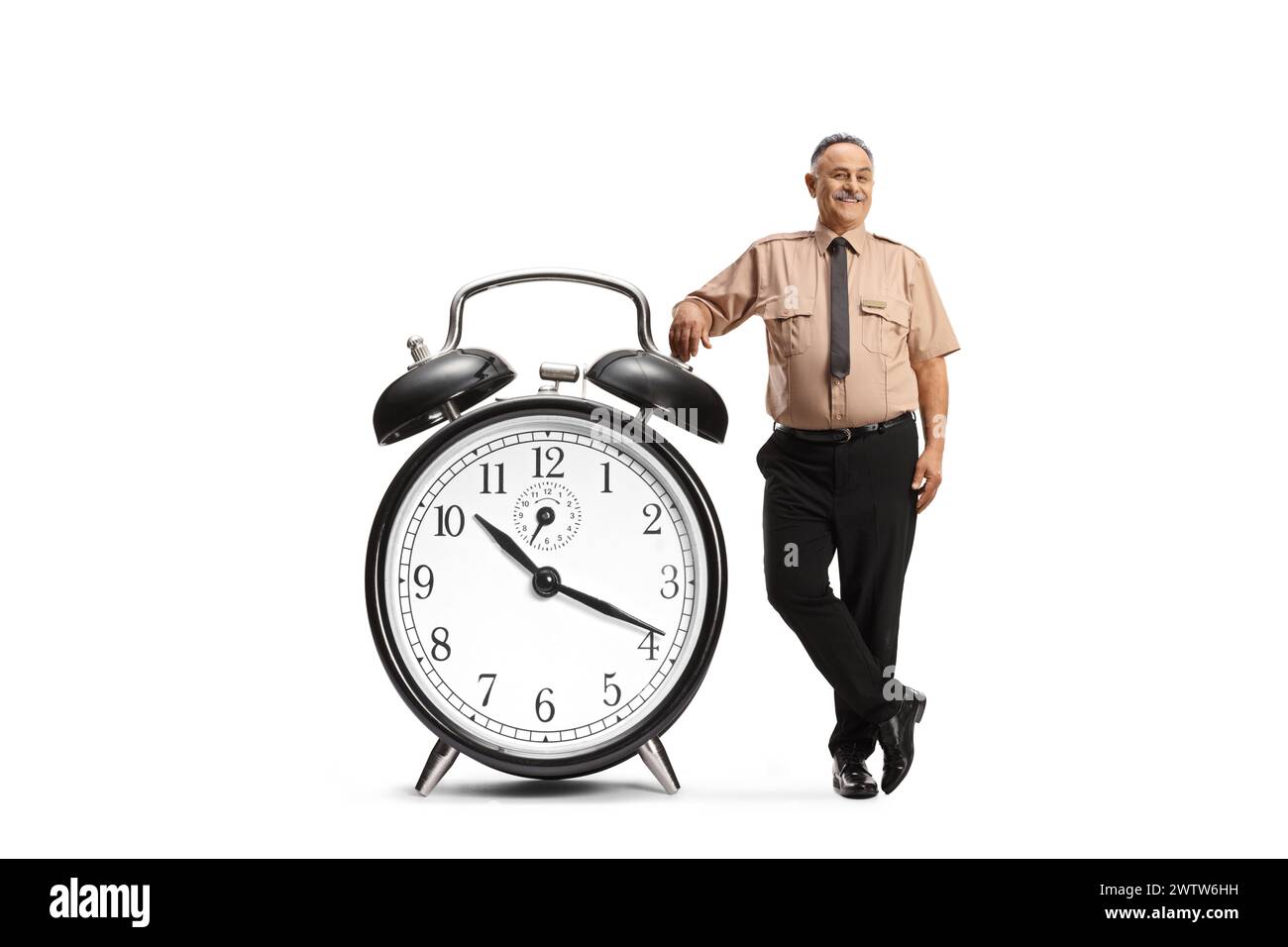 Security officer leaning on a big alarm clock isolated on white ...
