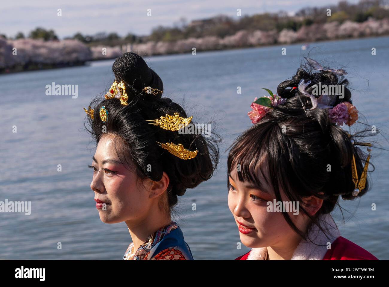 Ailin Deng, left, and Xinyu Liang, right, of New York, wear traditional ...