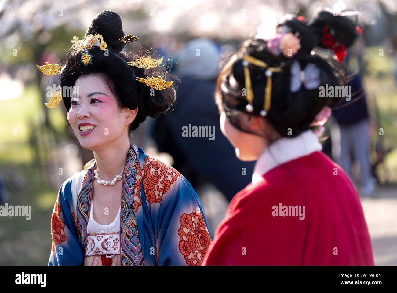 Ailin Deng, left, and Xinyu Liang, right, of New York, wear traditional Chinese clothing from ...