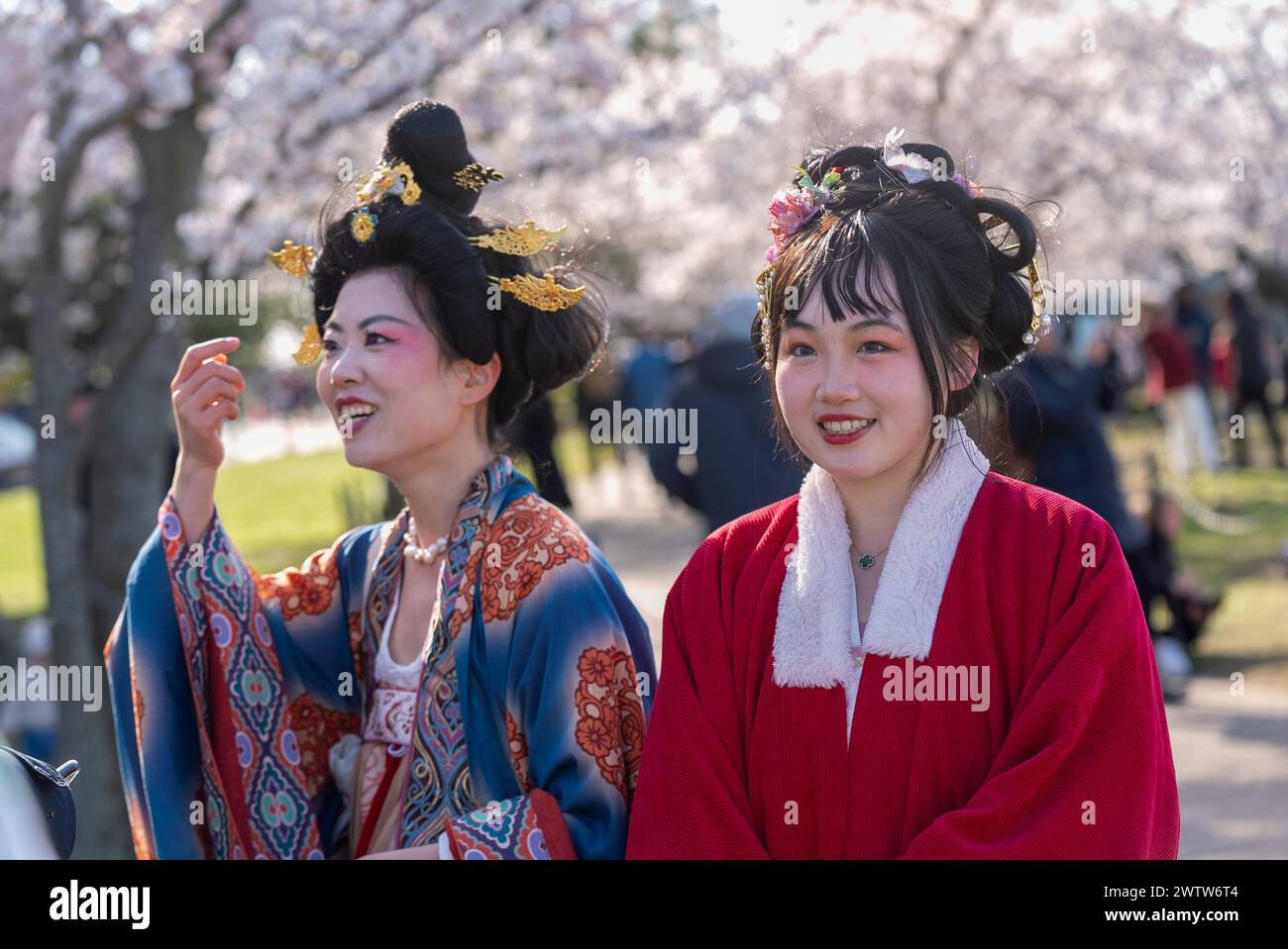 Ailin Deng, left, and Xinyu Liang, right, of New York, wear traditional Chinese clothing from ...