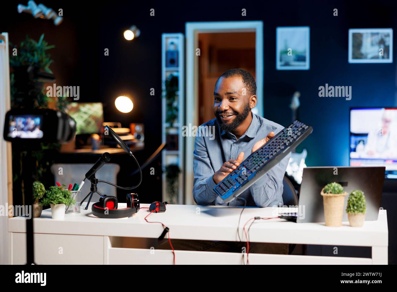 Cheerful media star being sponsored by partnering brand to do gaming ...