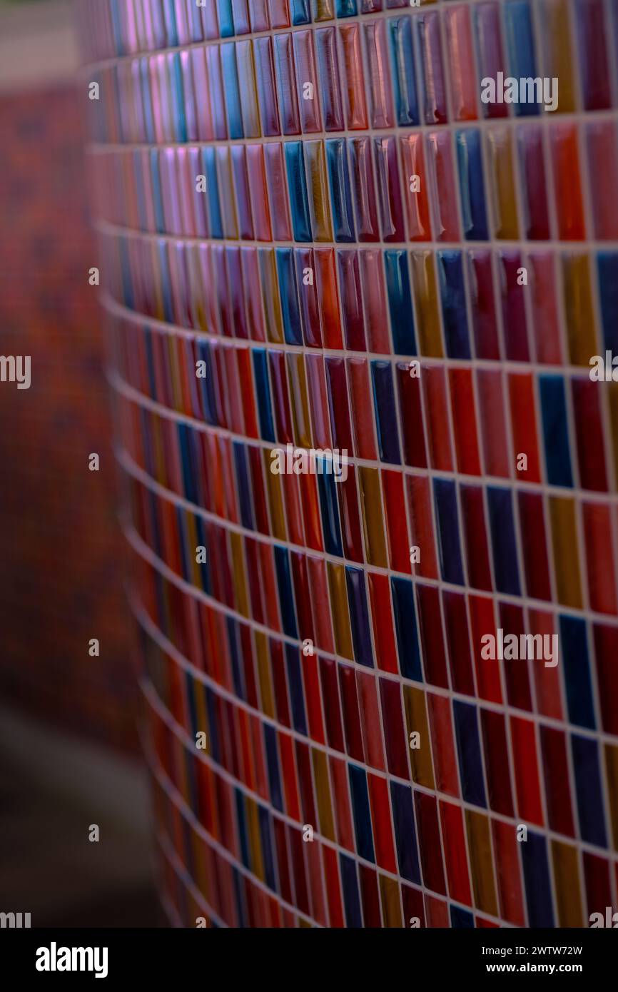 A vibrant, curved wall displaying a dynamic pattern of multicolored ...