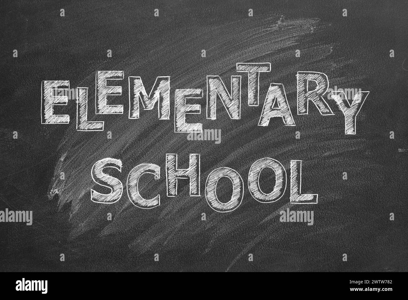 Hand drawn text Elementary school on black chalkboard Stock Photo - Alamy