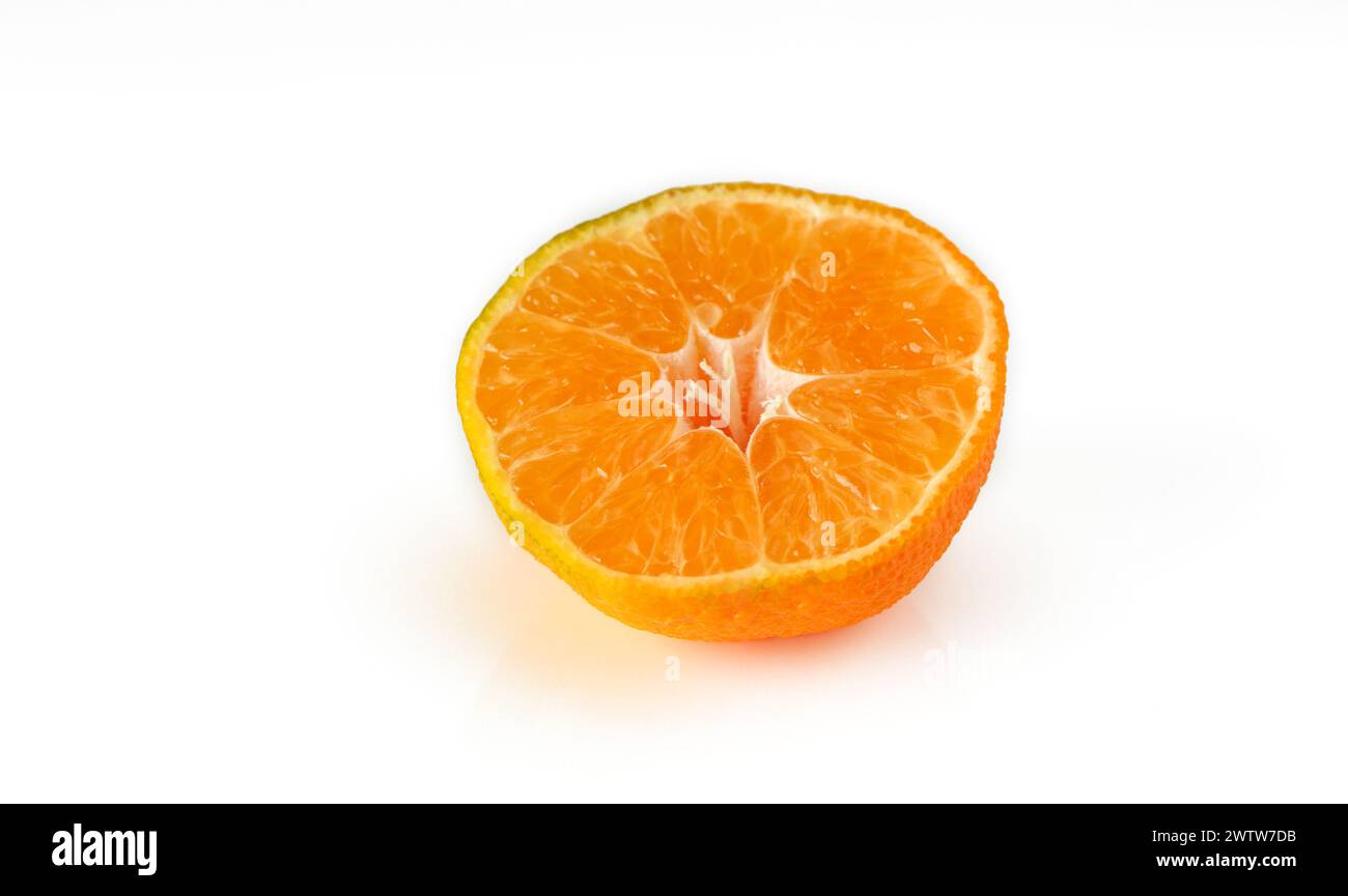 half of tangerine on white background Stock Photo - Alamy