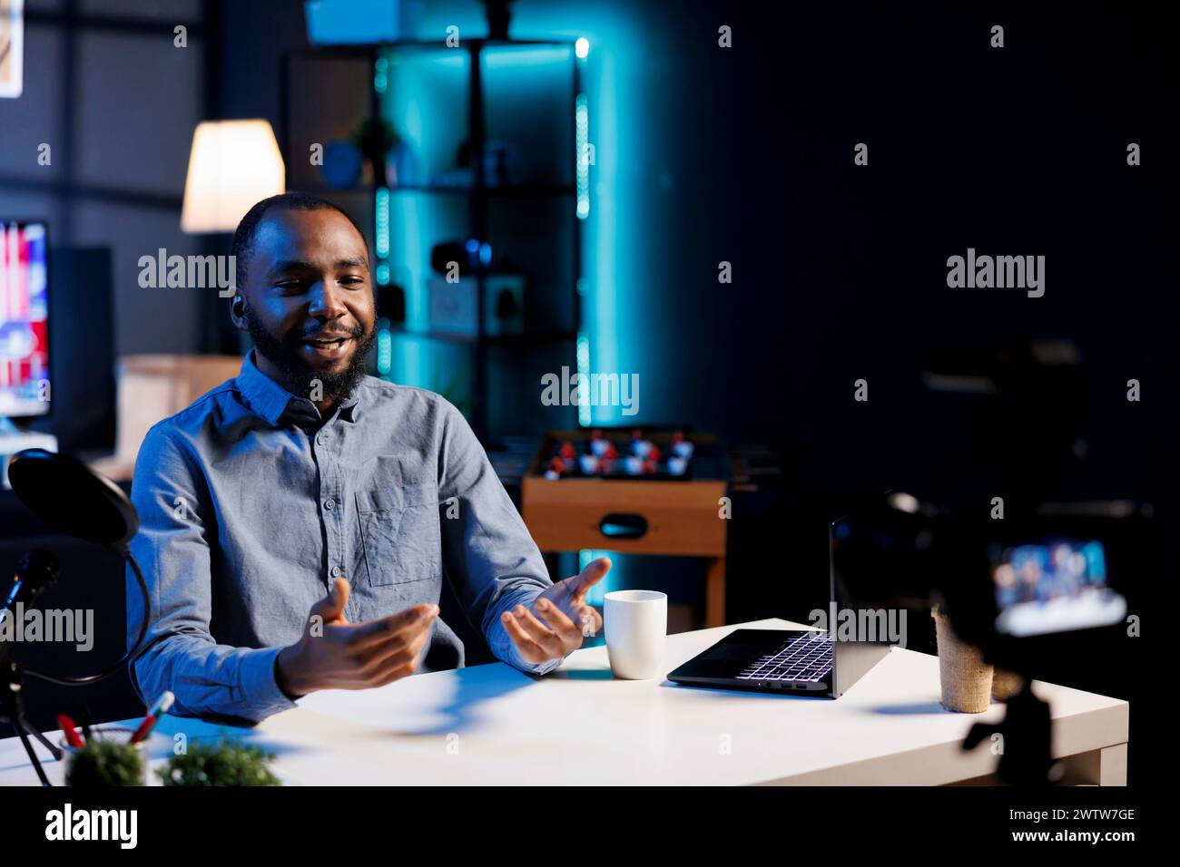 African american content creator filming technology review of different ...