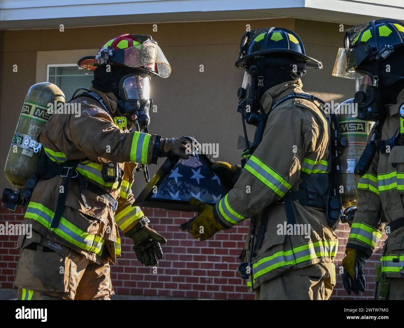Conducting salvage and overhaul during a real-world house fire, U.S ...