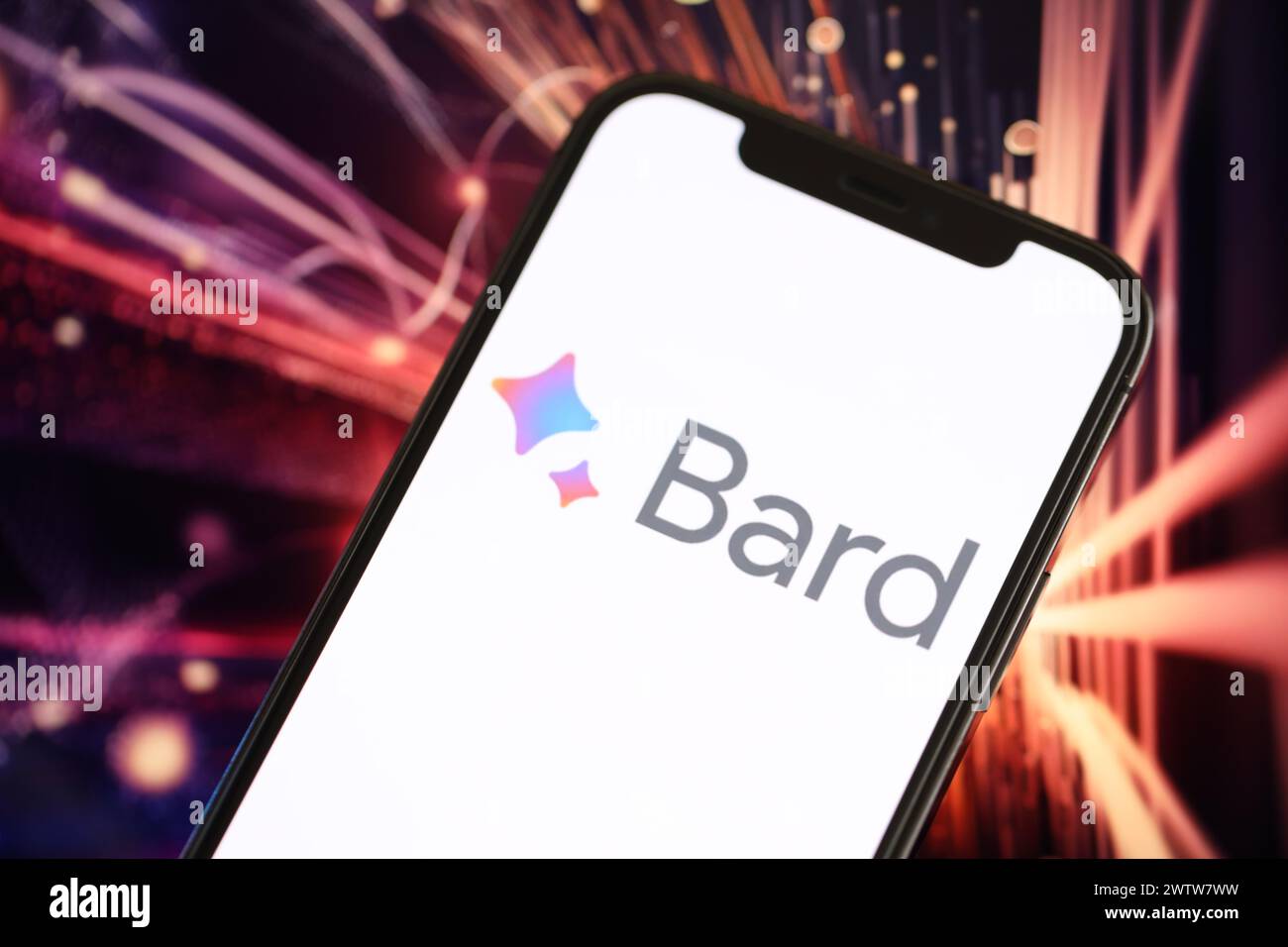 KYIV, UKRAINE - MARCH 17, 2024 Google Bard logo on iPhone display screen with background of ...