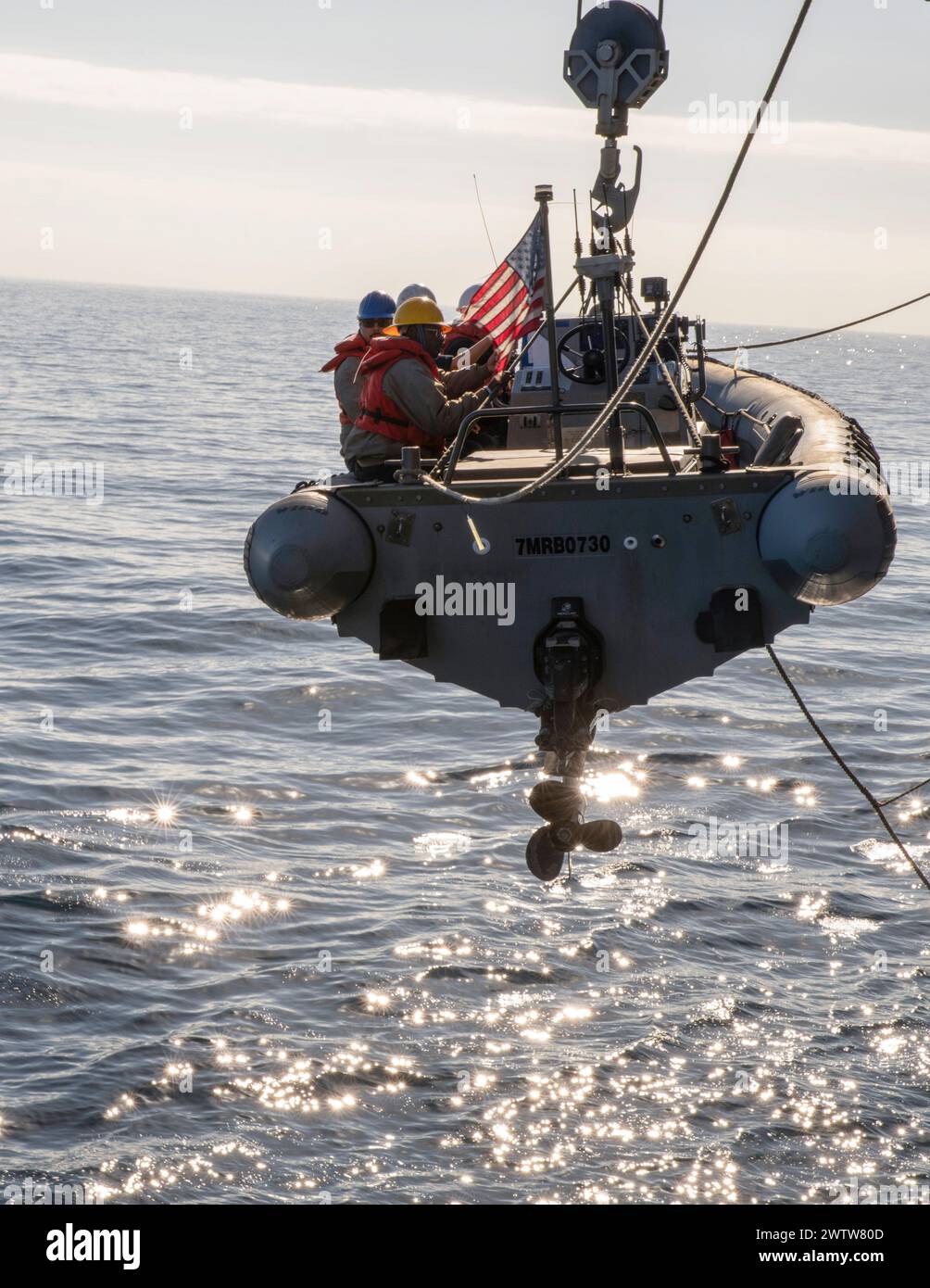 U.S. Sailors assigned to the amphibious dock landing ship USS Harpers ...