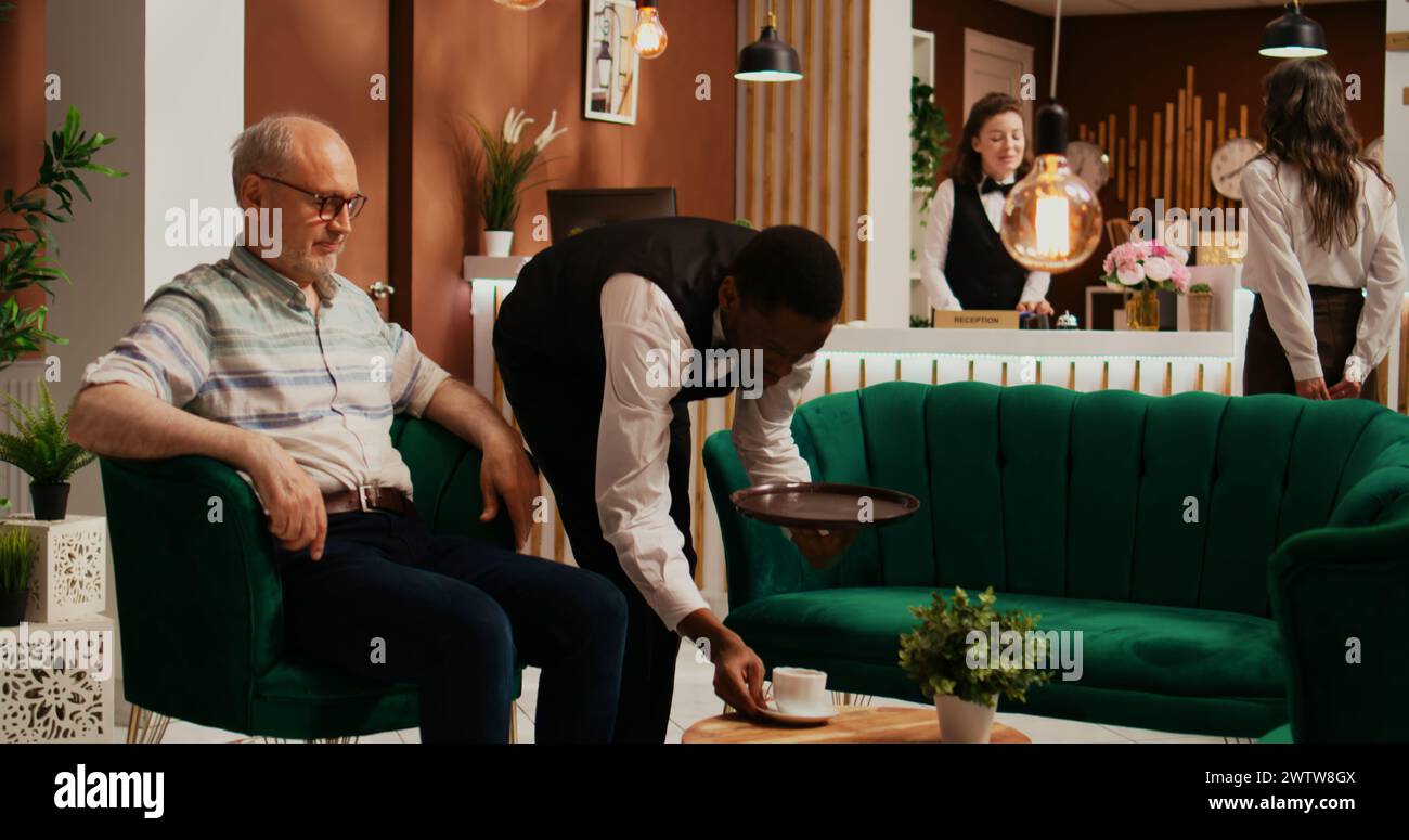 Older couple hotel front desk hi-res stock photography and images - Alamy