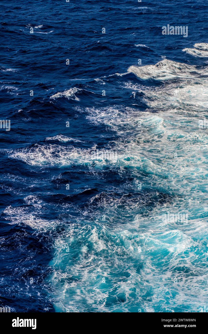 Capturing the deep blue hue of the sea, the image highlights the rhythmic patterns made by waves ...
