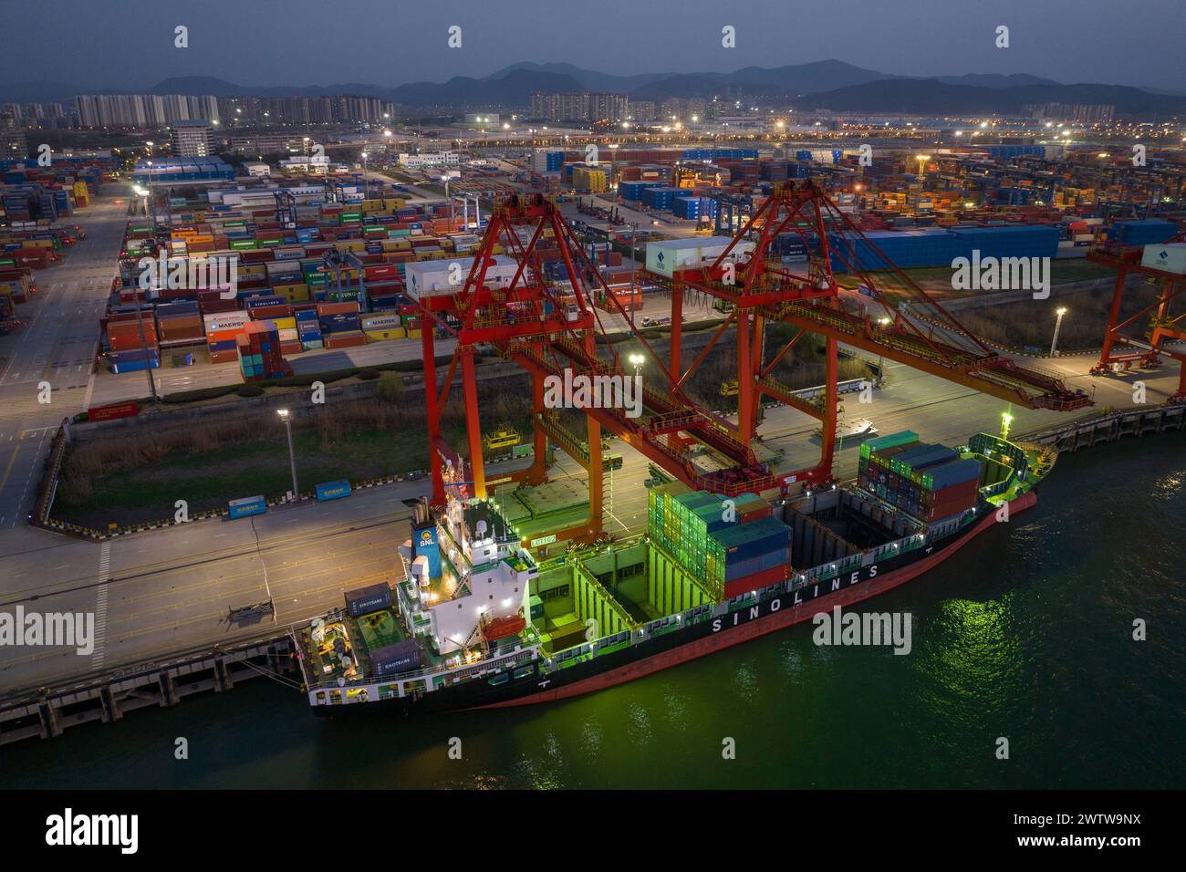 NANJING, CHINA - MARCH 19, 2024 - Cargo ships dock at the container ...