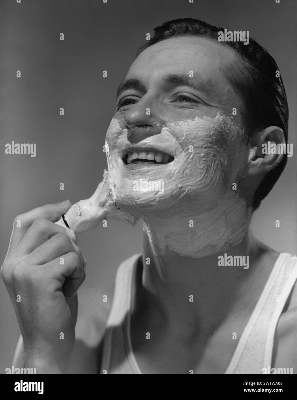 Man shaving on beard Black and White Stock Photos & Images - Alamy