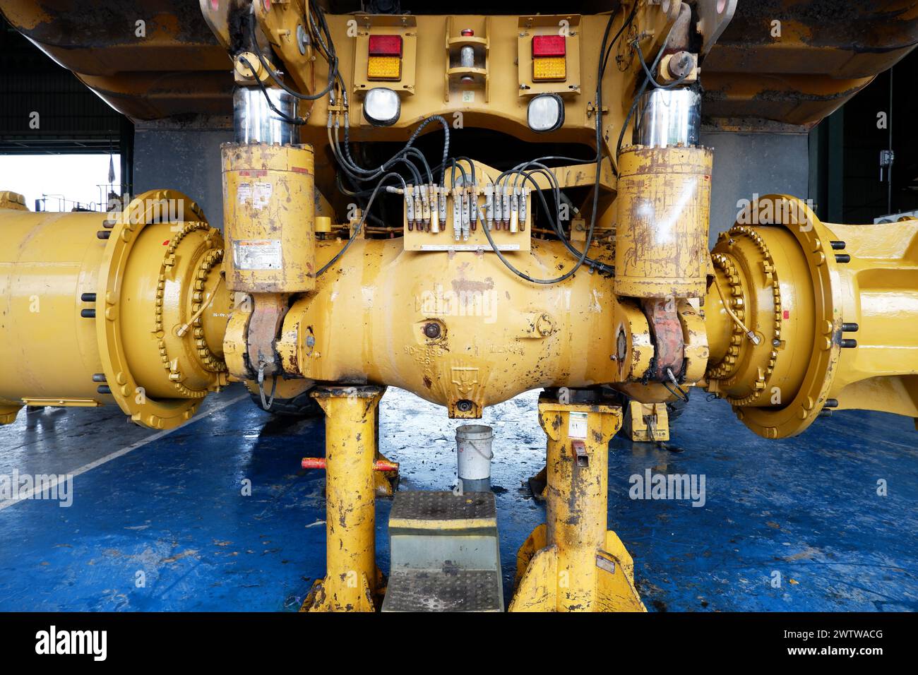 final drive and axle of a giant mining dump truck being serviced at ...