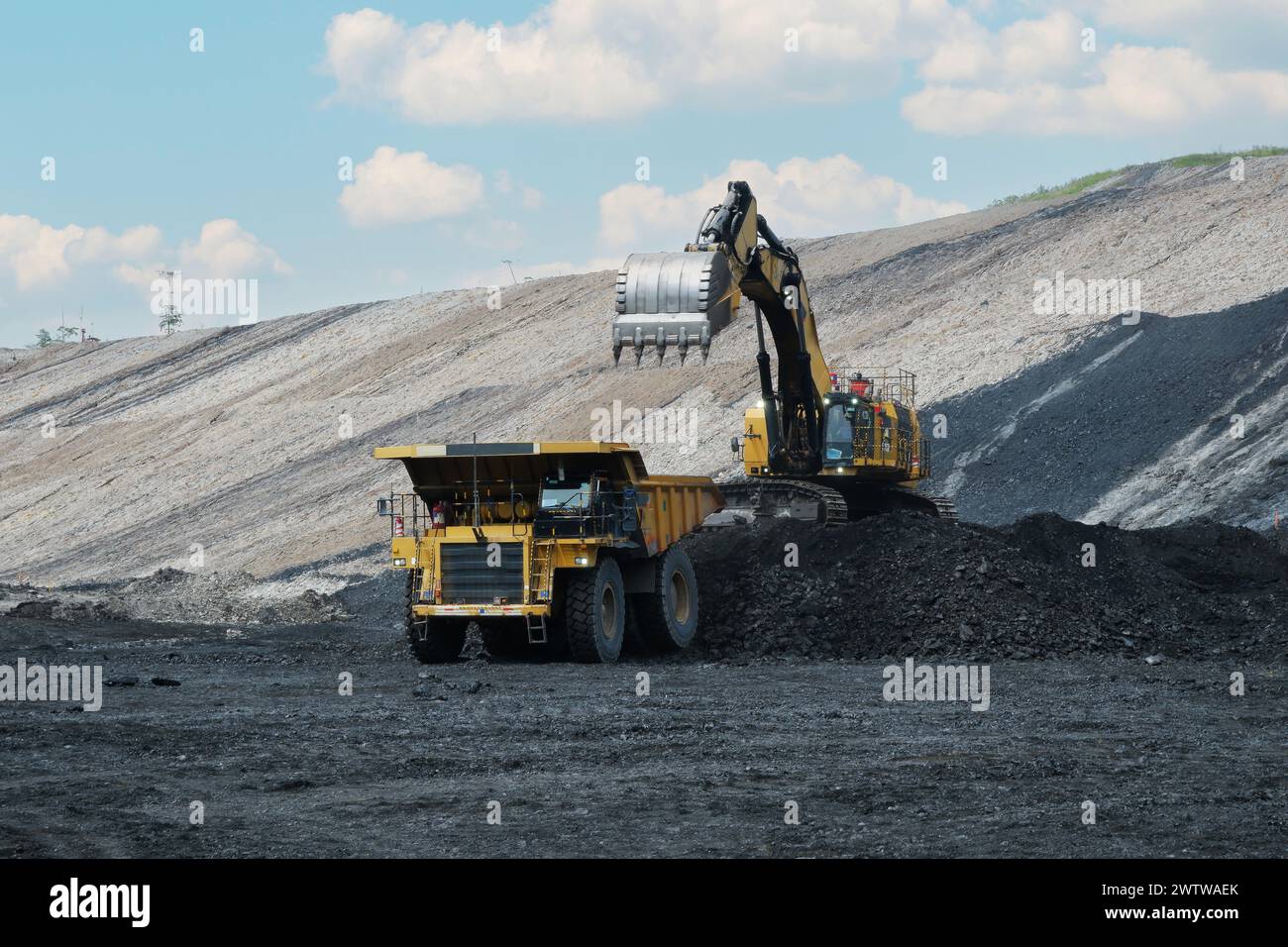 coal loading from excavator into truck, coal mine industry Stock Photo ...