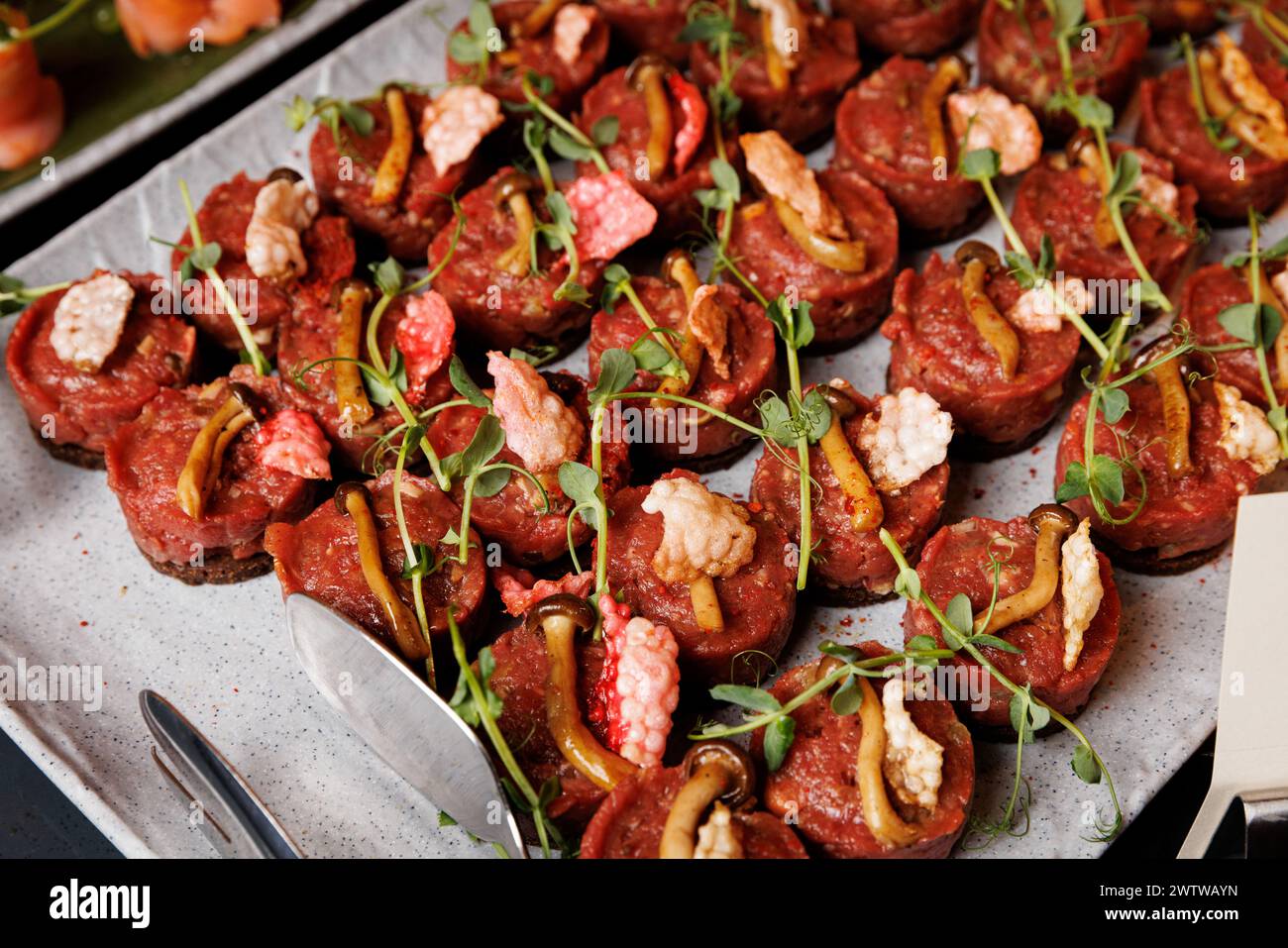 Set of small beef meat tartare Stock Photo - Alamy