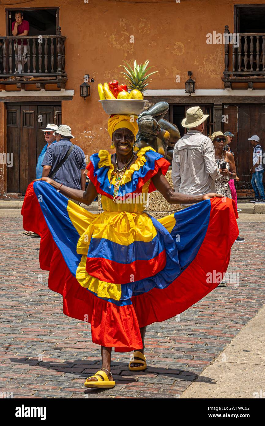 Cartagena, Colombia - July 25, 2023: Woman with colorful traditional ...
