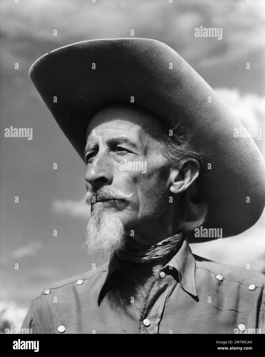 Image of an older man with a mustache and a gray goatee, wearing a ...