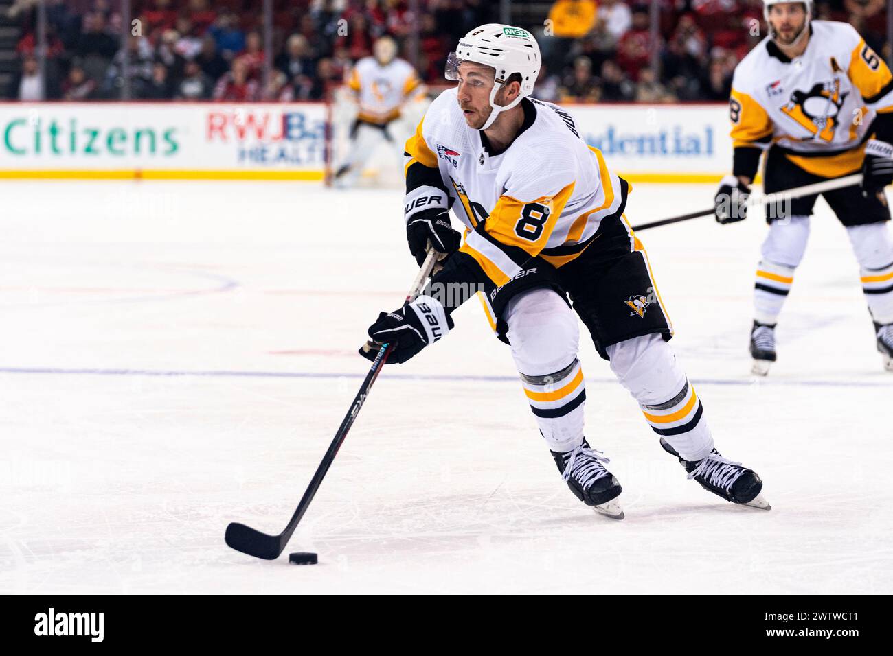 Pittsburgh Penguins left wing Michael Bunting (8) look to pass the puck ...