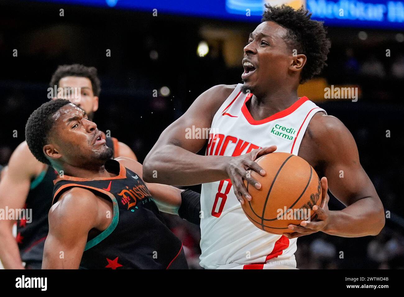 Houston Rockets forward Jae'Sean Tate, right, collides with Washington ...
