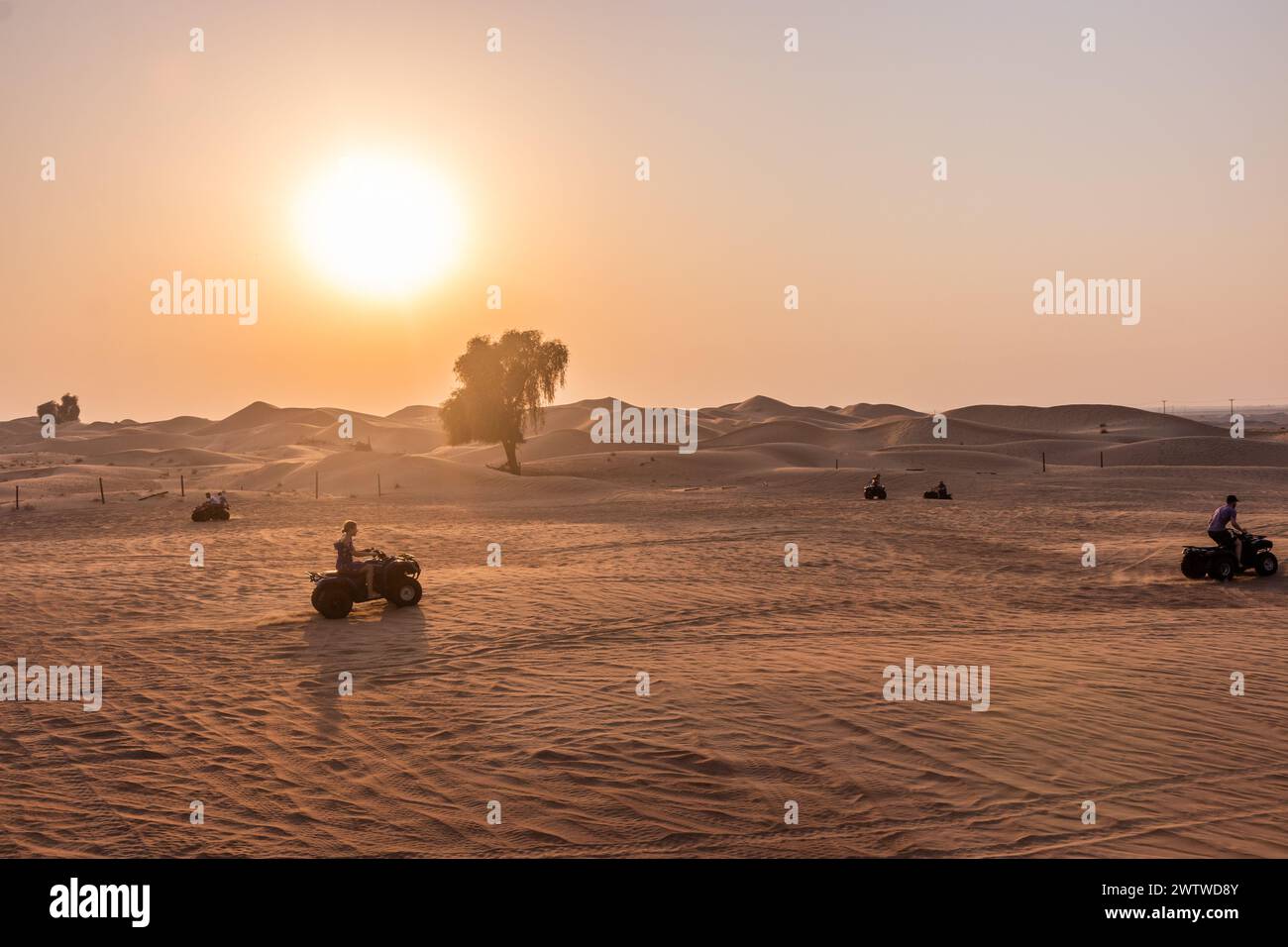 UAE - OCTOBER 16, 2021: Tourists on quad bikes in a desert of United ...