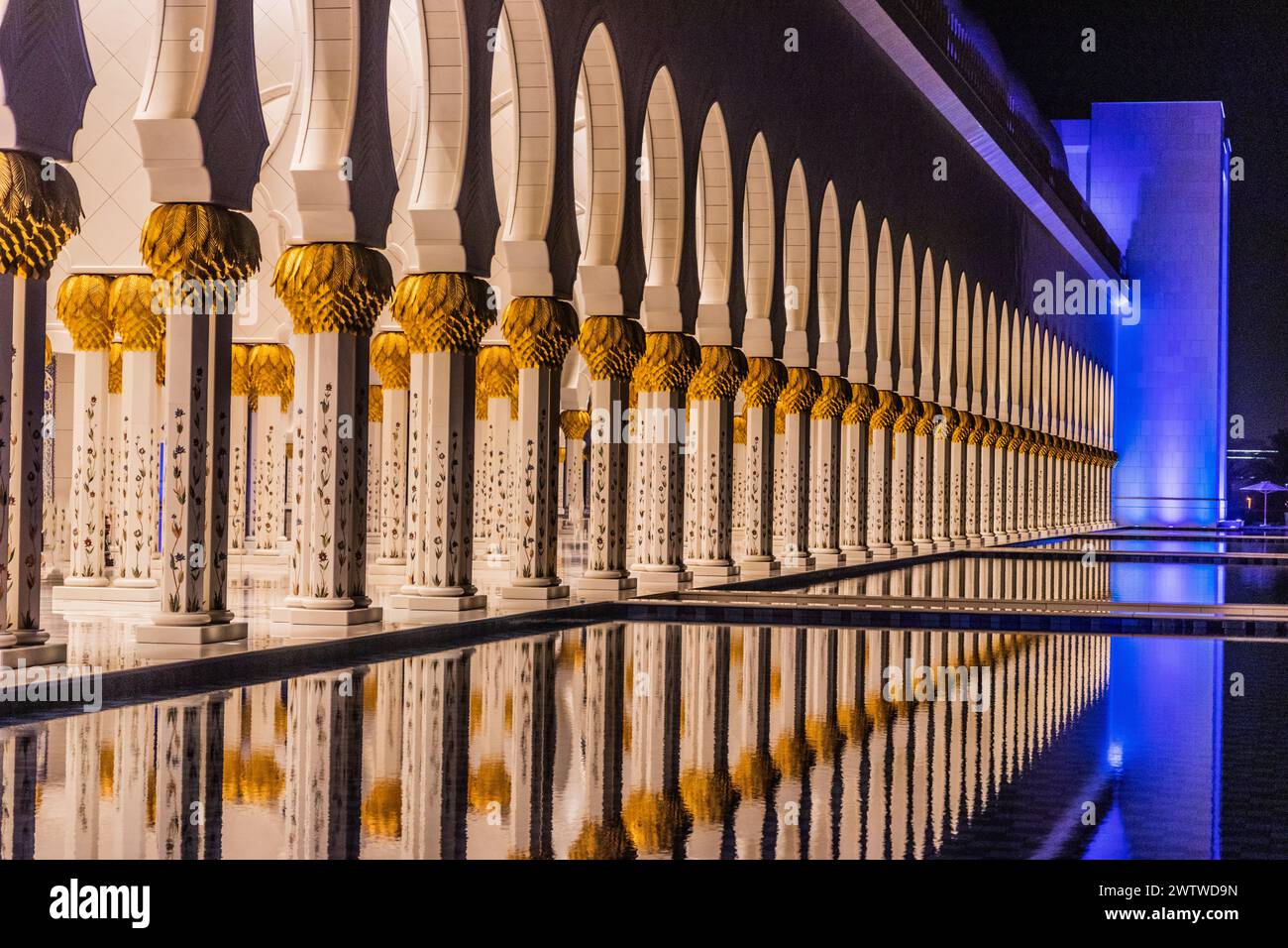 Night view of the colonnade of Sheikh Zayed Grand Mosque in Abu Dhabi ...