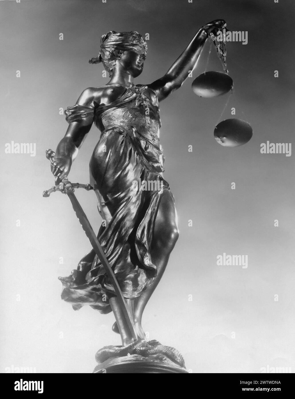 Close up of a statue of Lady of Justice, blindfolded holding scales and a sword Stock Photo - Alamy