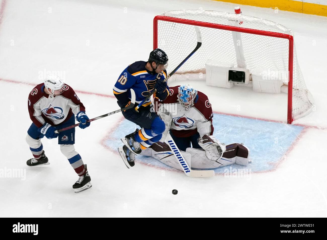 St. Louis Blues' Brayden Schenn (10) leaps out of the way of the puck ...