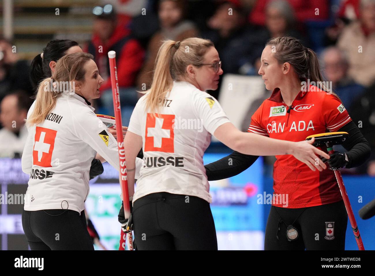 Canada's Rachel Homan, right, shakes hands with Switzerland's Silvana ...