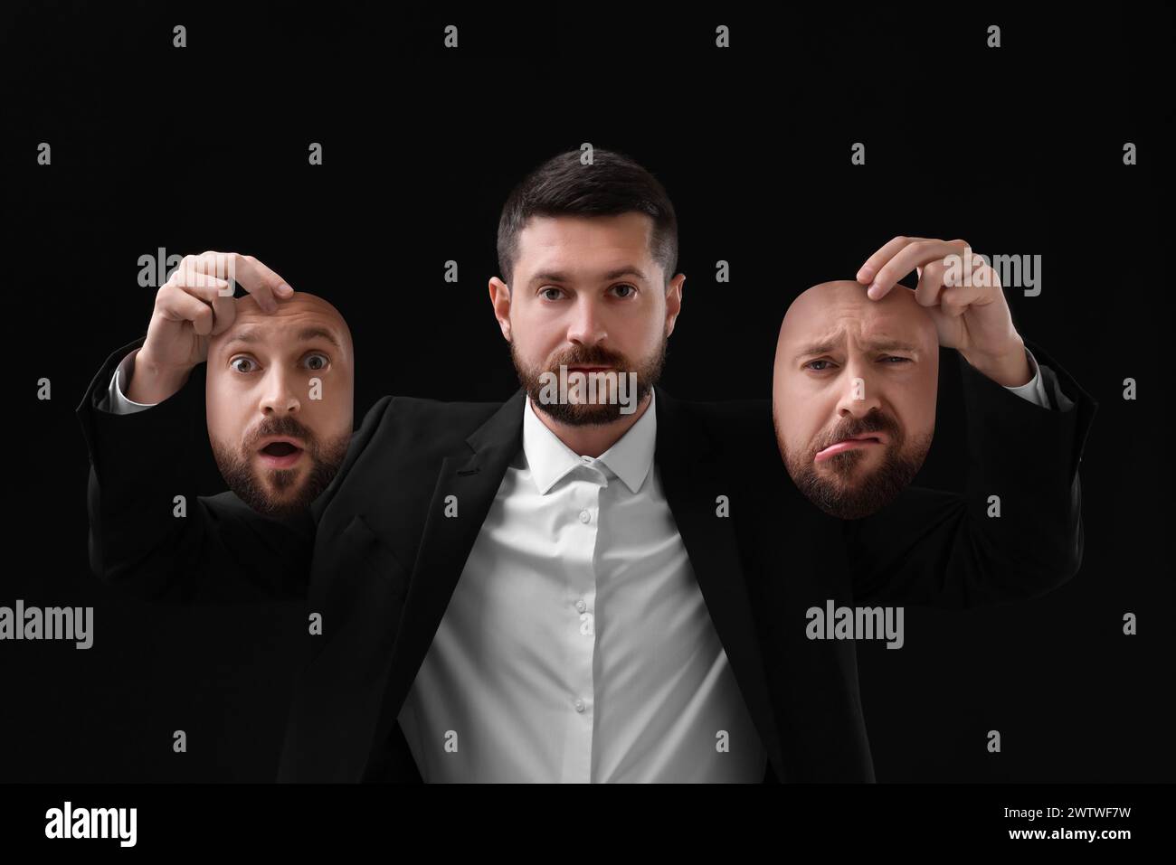 Man holding masks with his face showing different emotions on black ...