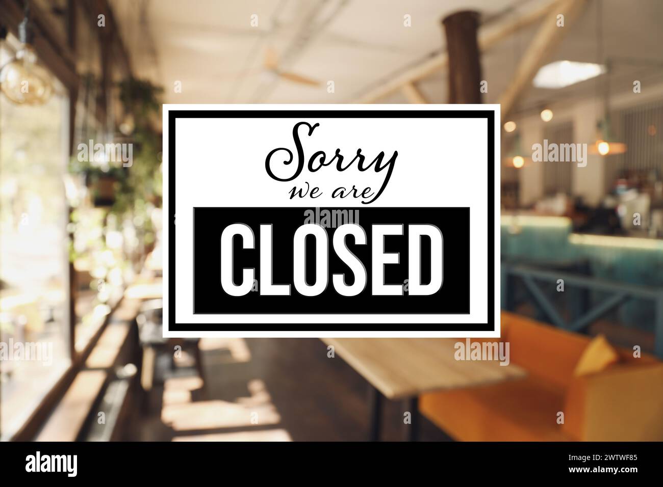 Sorry we are closed sign against blurred background Stock Photo - Alamy
