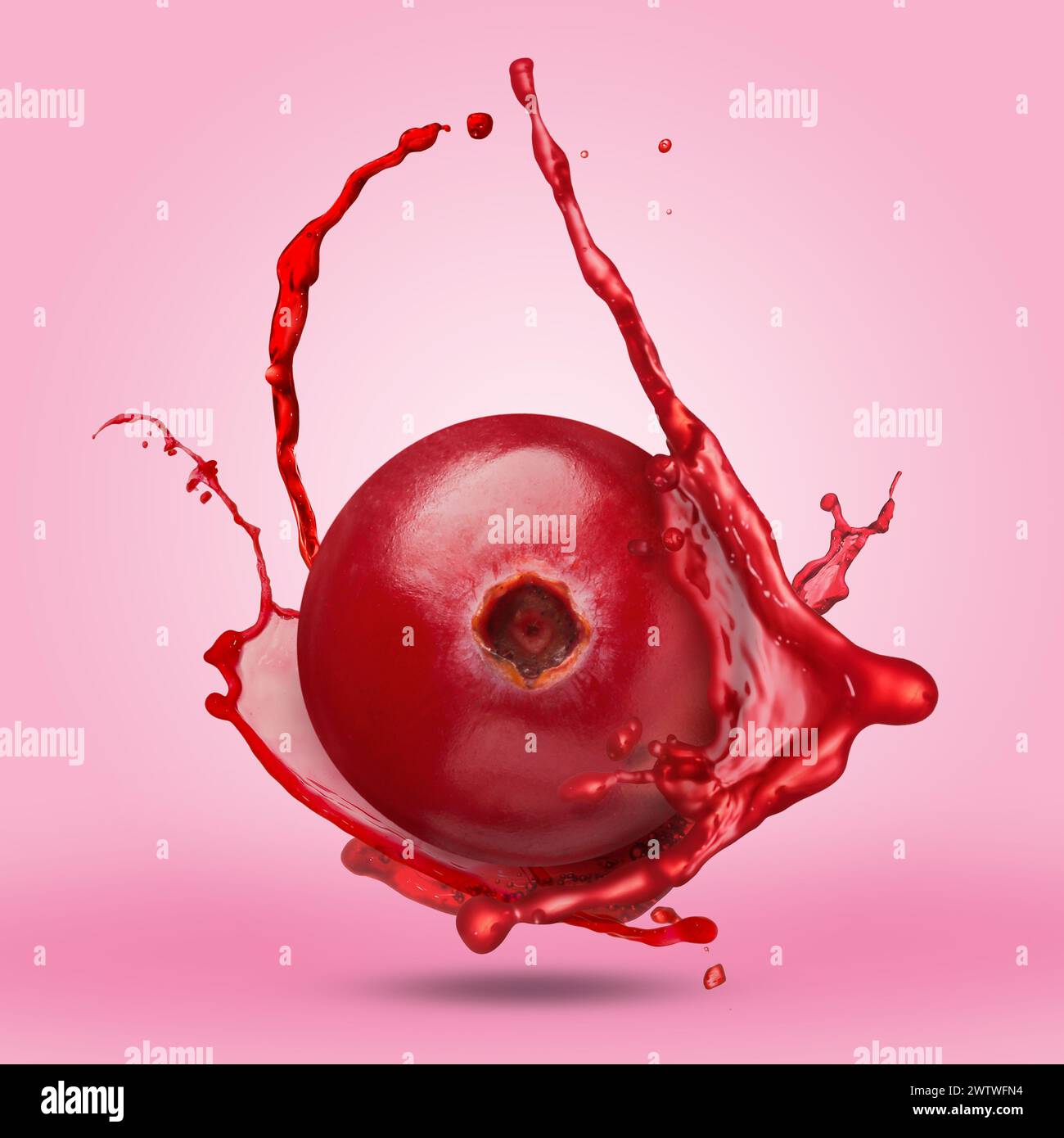 Delicious ripe cranberry and splashing juice in air on pink background ...