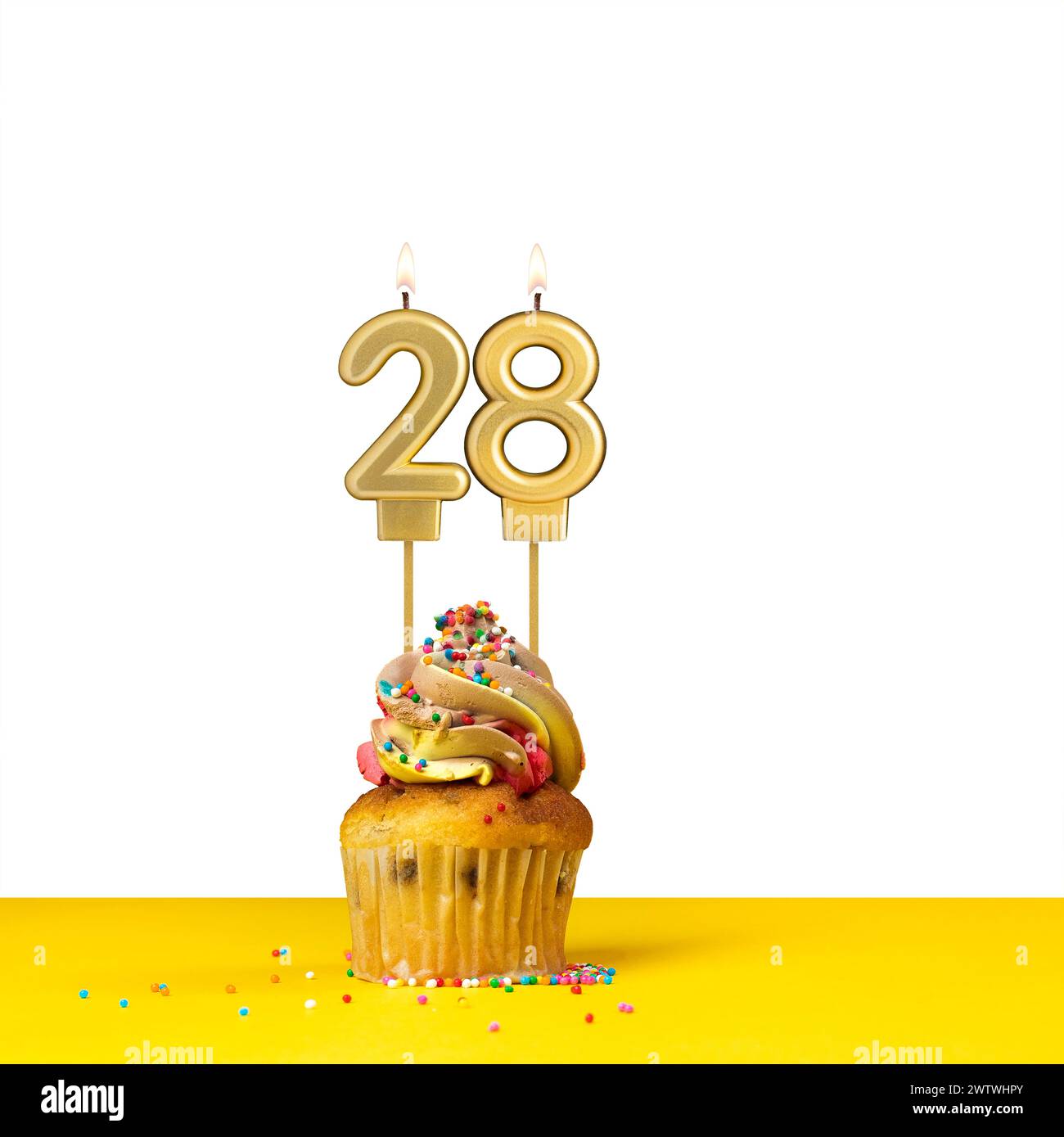 Birthday candle number 28 - Cupcake on white background Stock Photo - Alamy