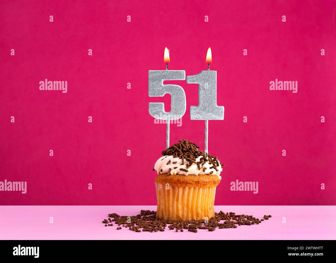 Birthday cupcake with candle number 51 - Birthday card on pink ...