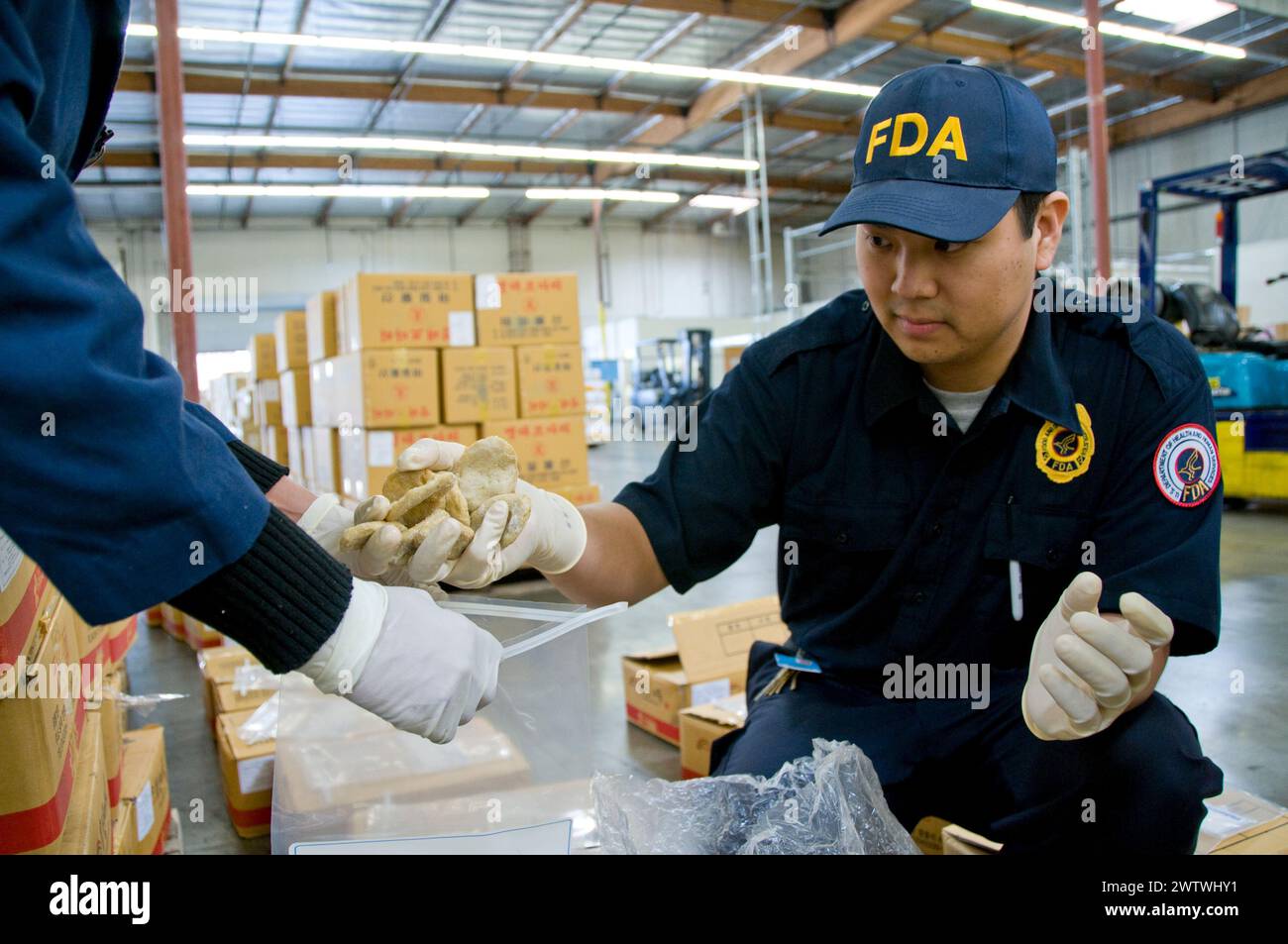 FDA field inspectors prepare samples of imported seafood for laboratory ...