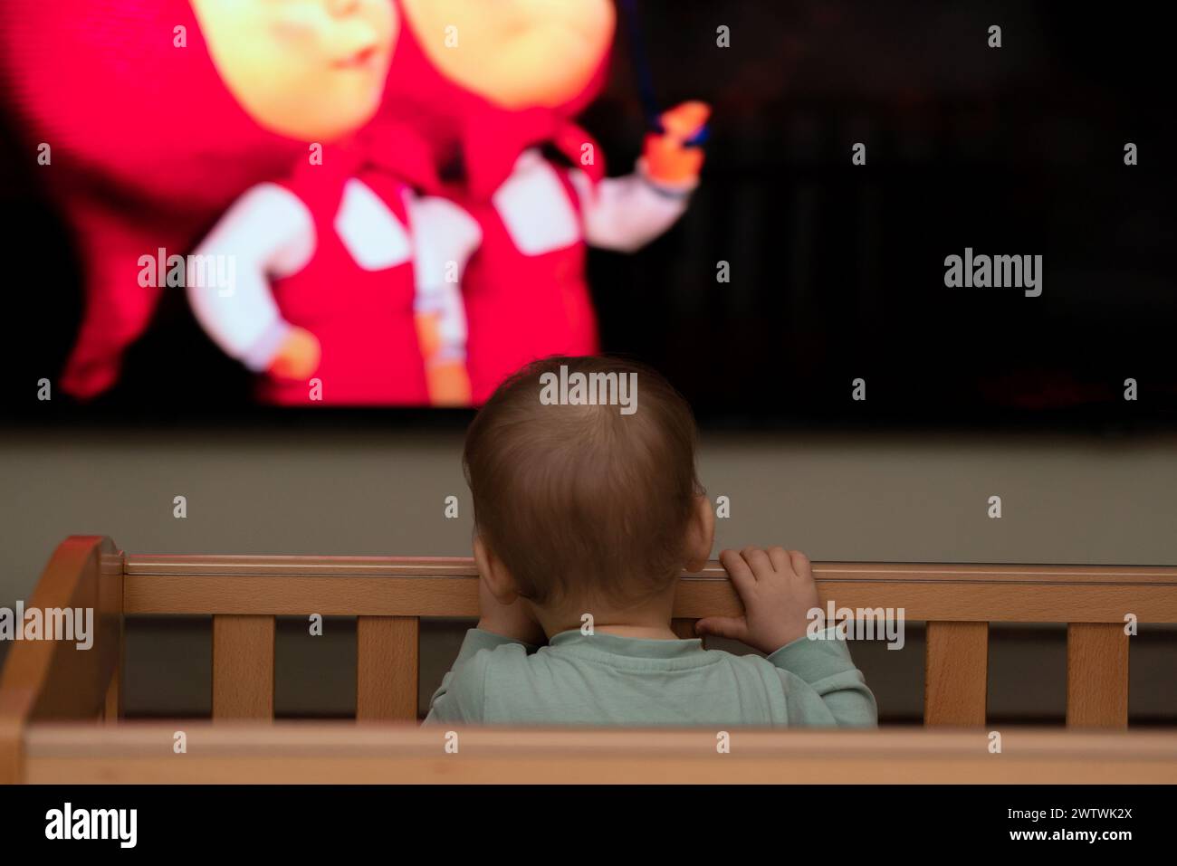 Watching cartoons as a child learning concept. TV show Stock Photo - Alamy
