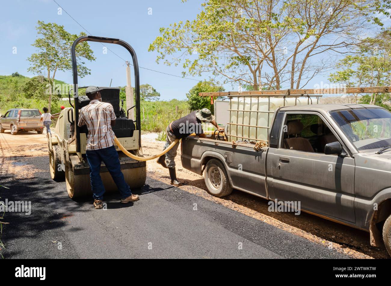 Transferring Water To Compactor Stock Photo - Alamy