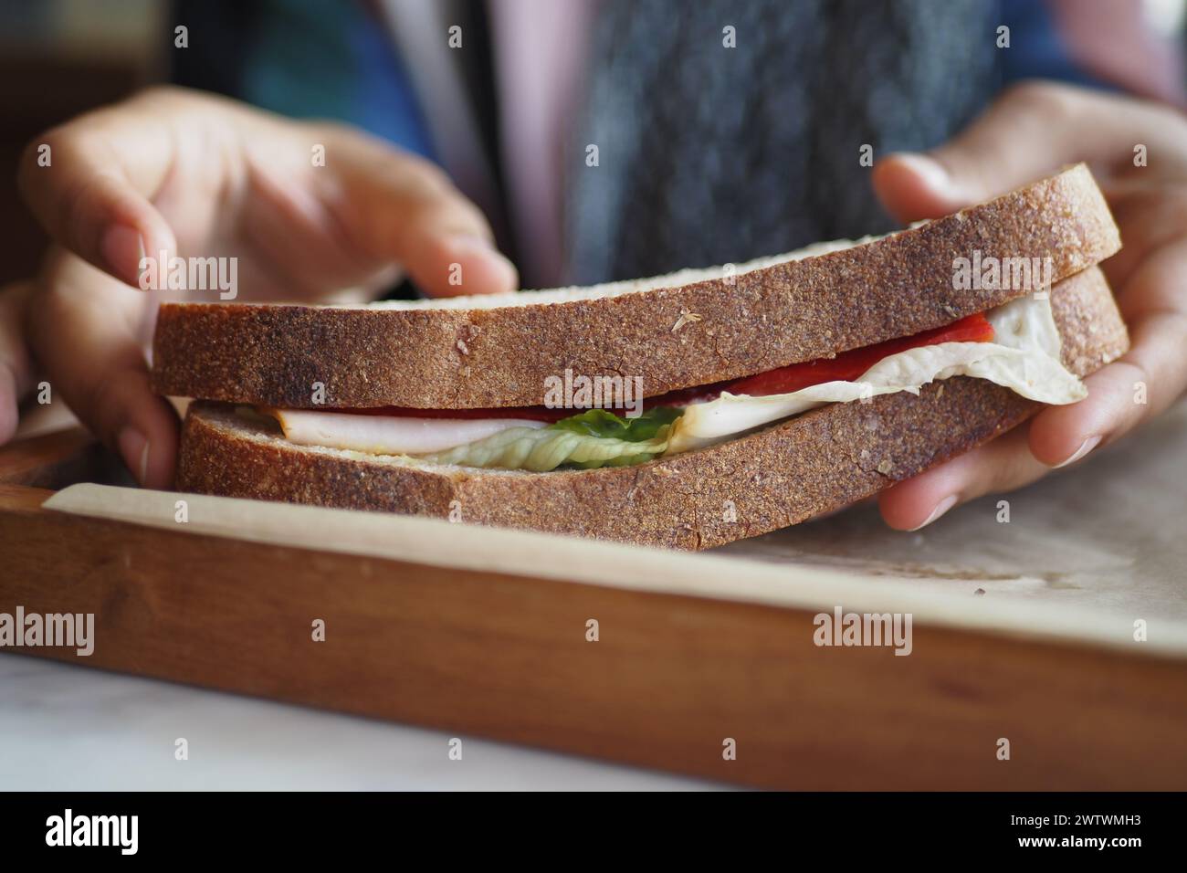 women hand pick Sandwich with ham, cheese, tomatoes Stock Photo - Alamy
