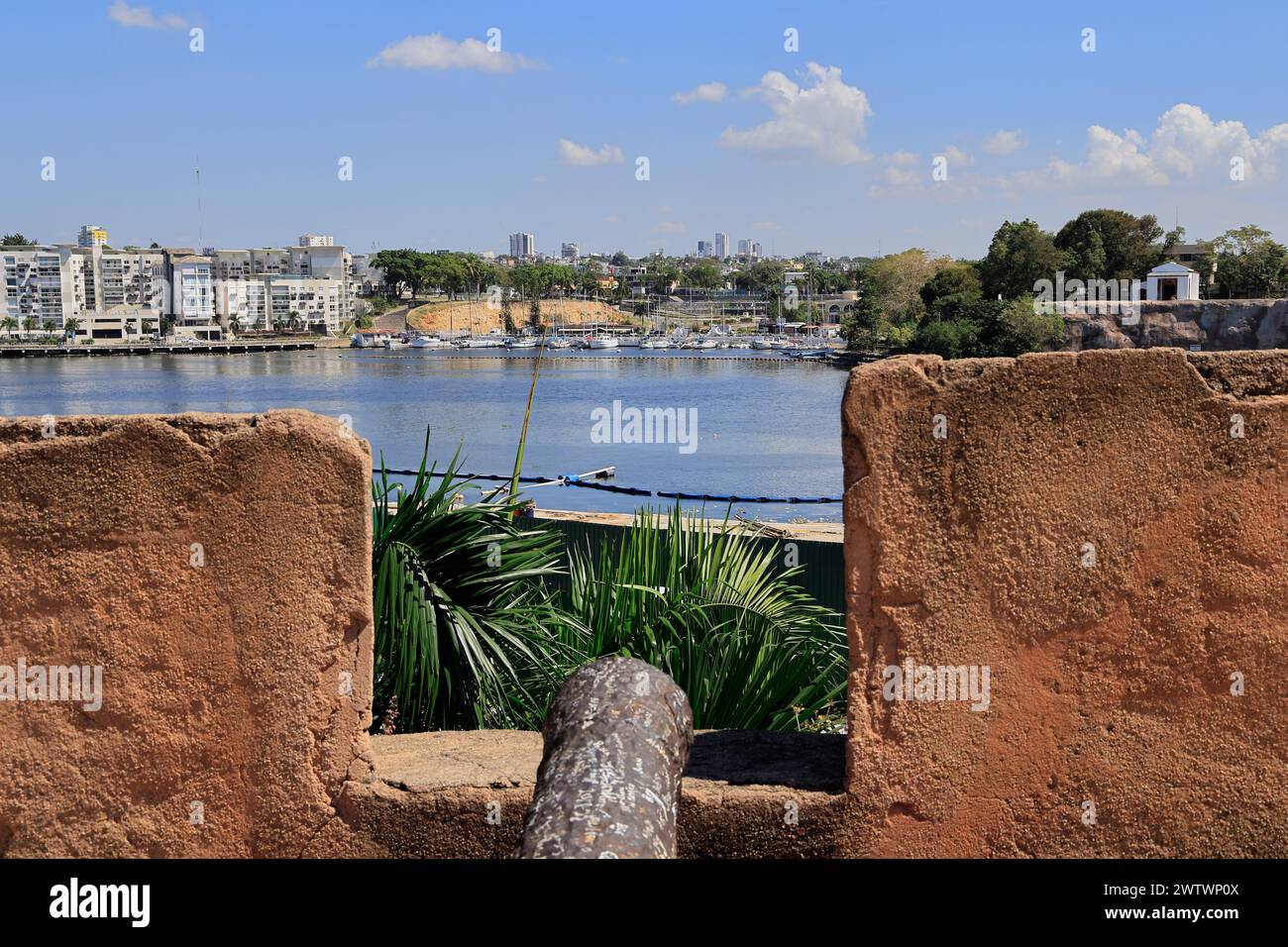The view of Ozama River from the historic city wall in Plaza del Reloj ...