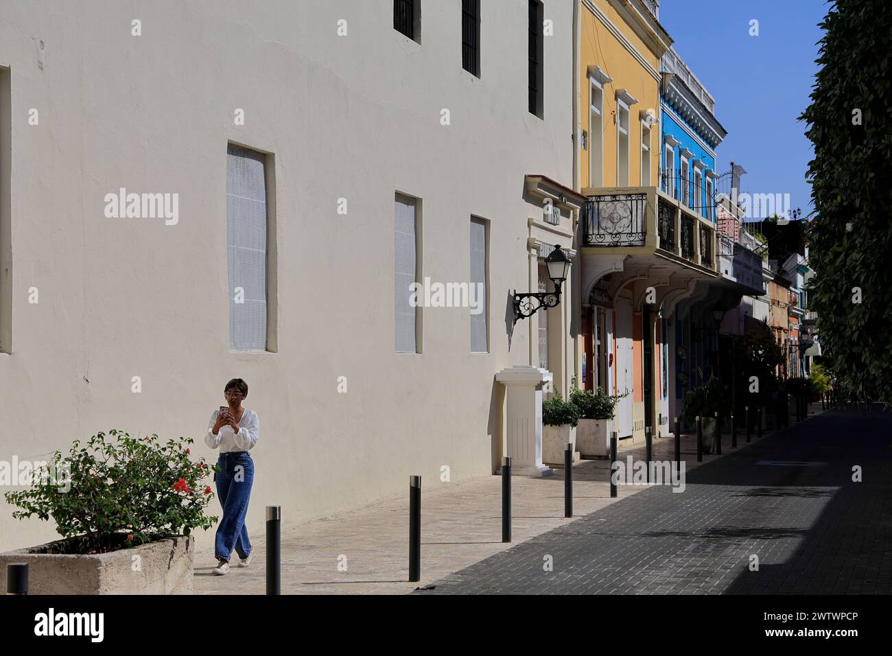 Street with pastel-colored historic architectures in Colonial Zone in ...