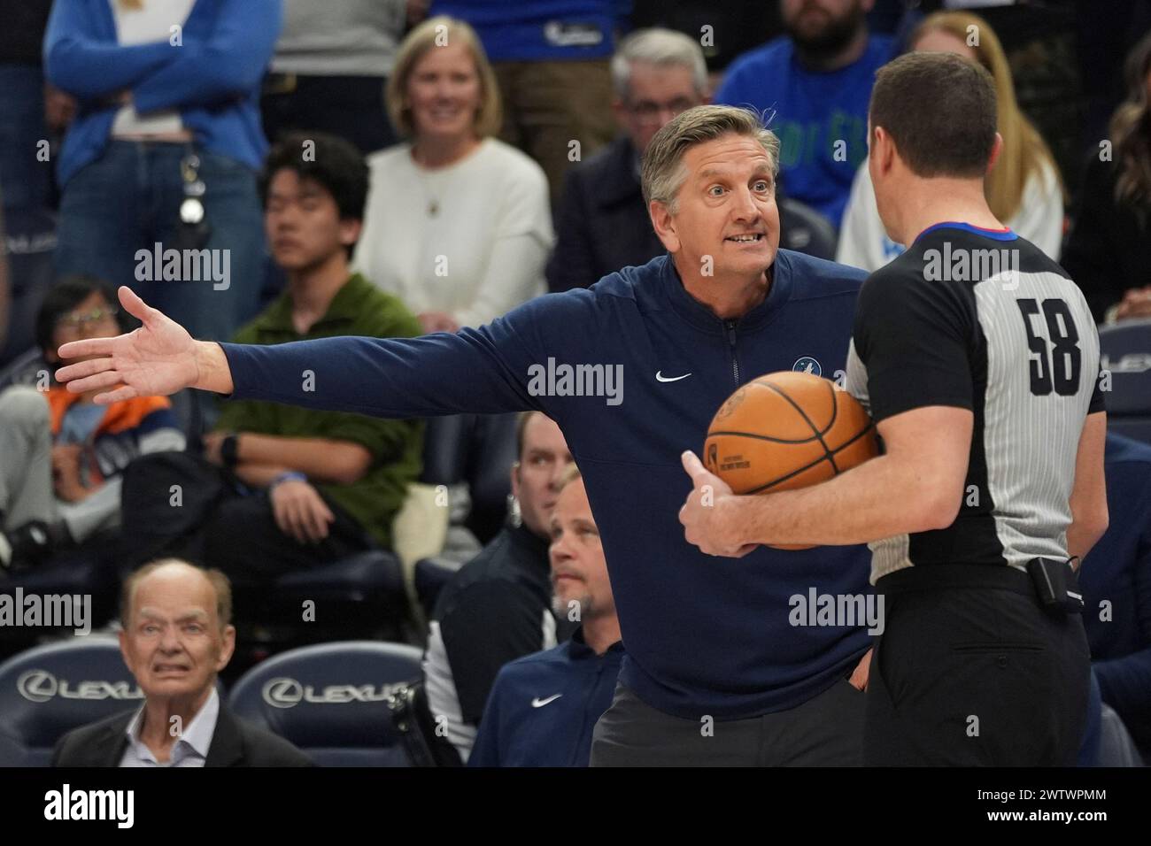 Minnesota Timberwolves head coach Chris Finch, left, reacts toward ...