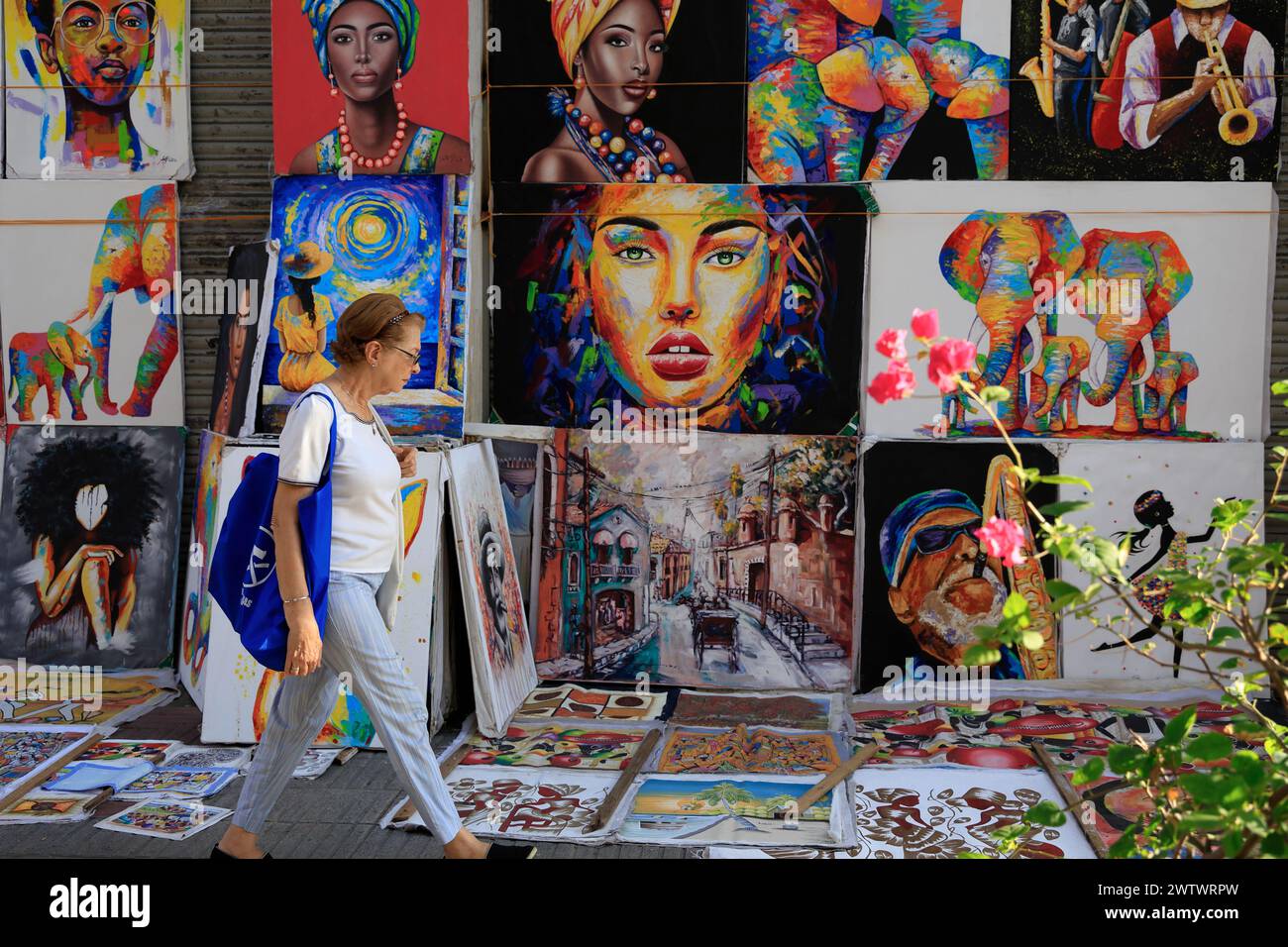 Paintings for sale on the sidewalk of Calle El Conde / El Conde Street ...