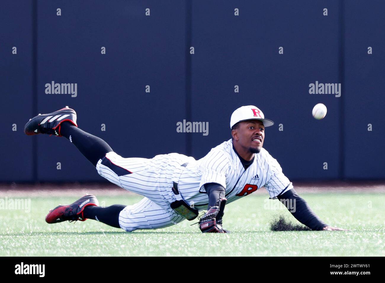 Rutgers right fielder RJ Johnson Jr. (1) dives for the ball but can't ...