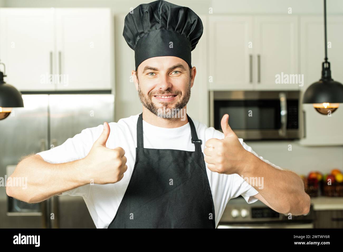 Happy chef cook with thumb up. Restaurant menu concept. Hispanic man in ...