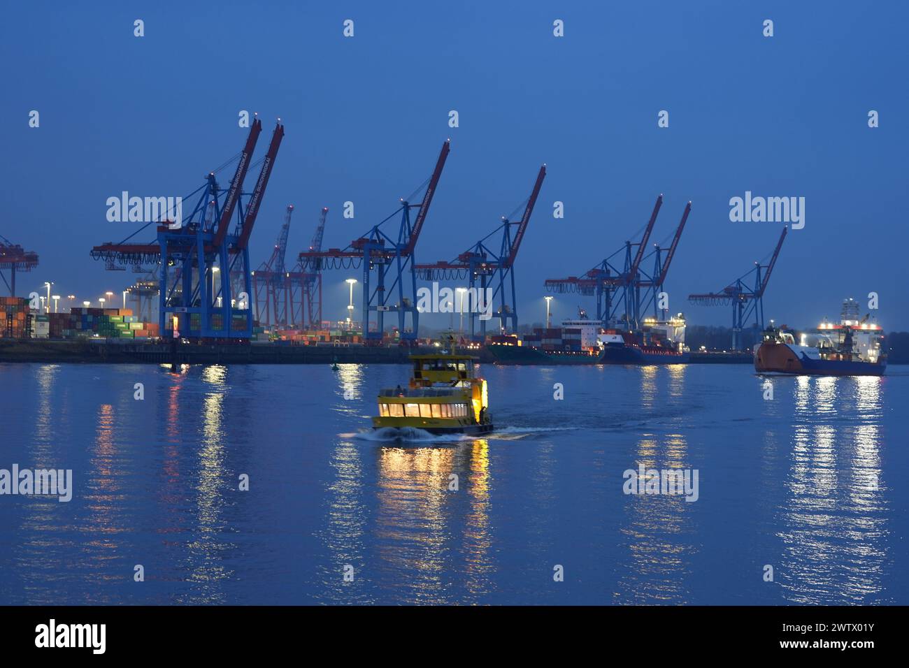 Hamburg, Germany. 20th Mar, 2024. Container ships are loaded and ...