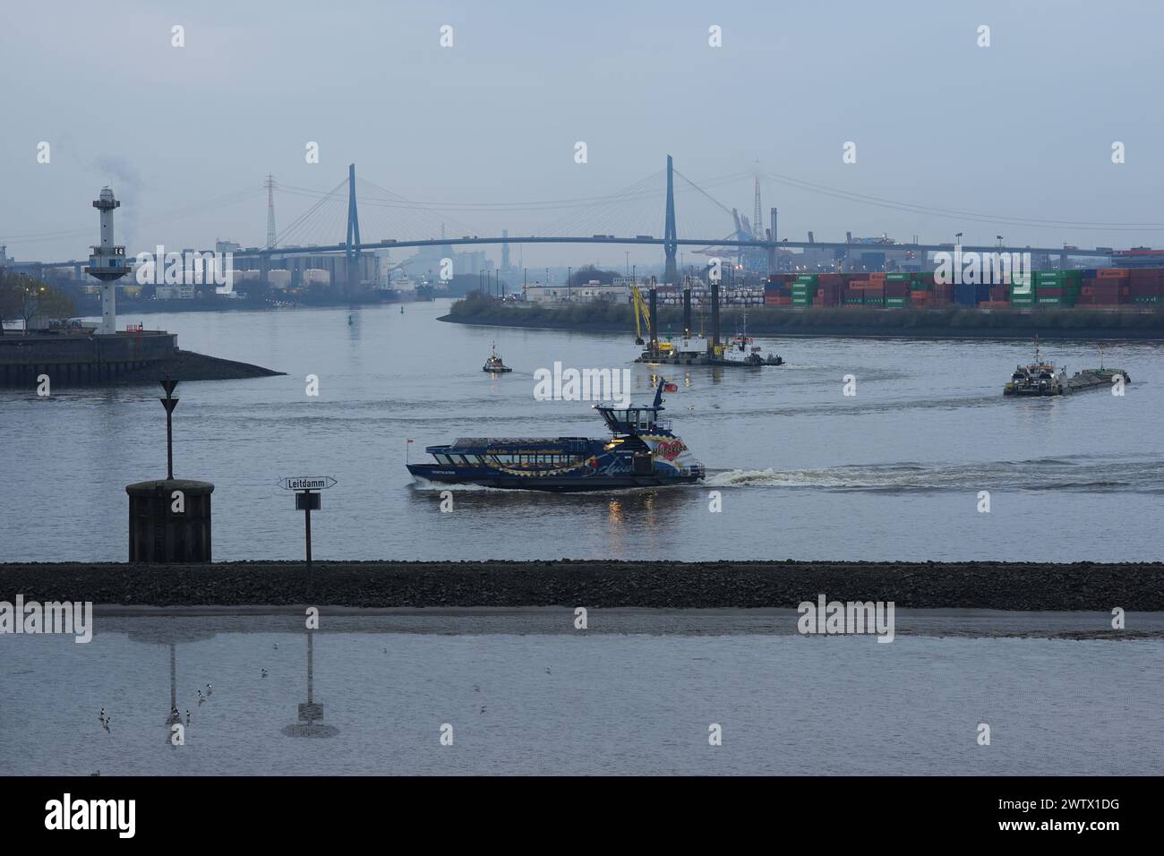 Hamburg, Germany. 20th Mar, 2024. Harbor ferries, cargo ships and ...