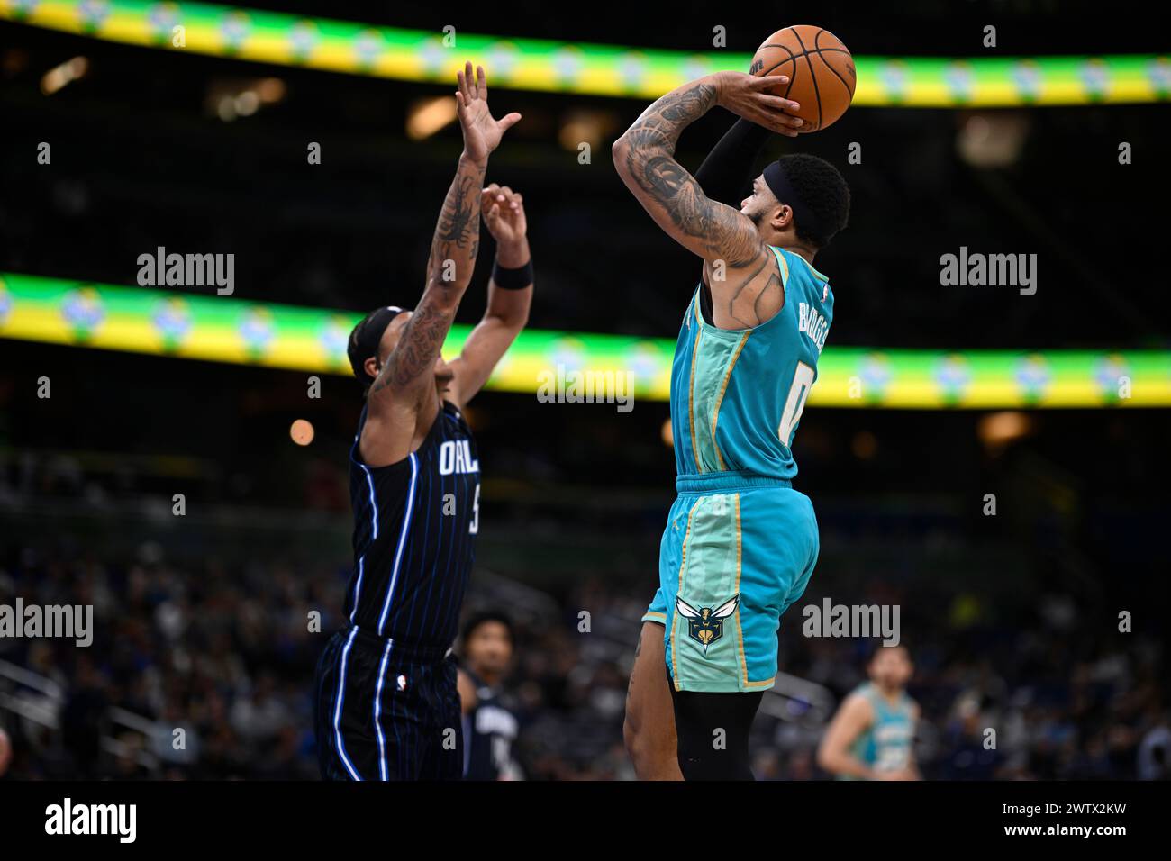 Charlotte Hornets forward Miles Bridges (0) goes up to shoot as Orlando Magic forward Paolo ...